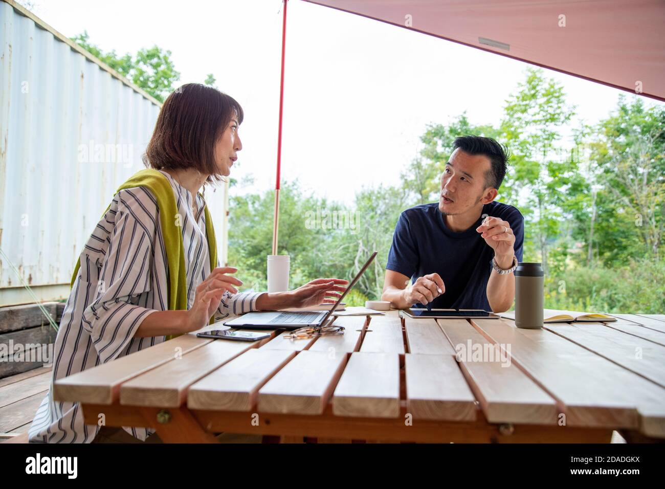 Man and Woman Having a Meeting on an Outdoor Office as New Normal Work ...
