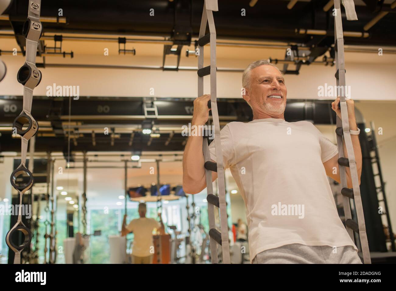 Man hanging on gym hi-res stock photography and images - Alamy