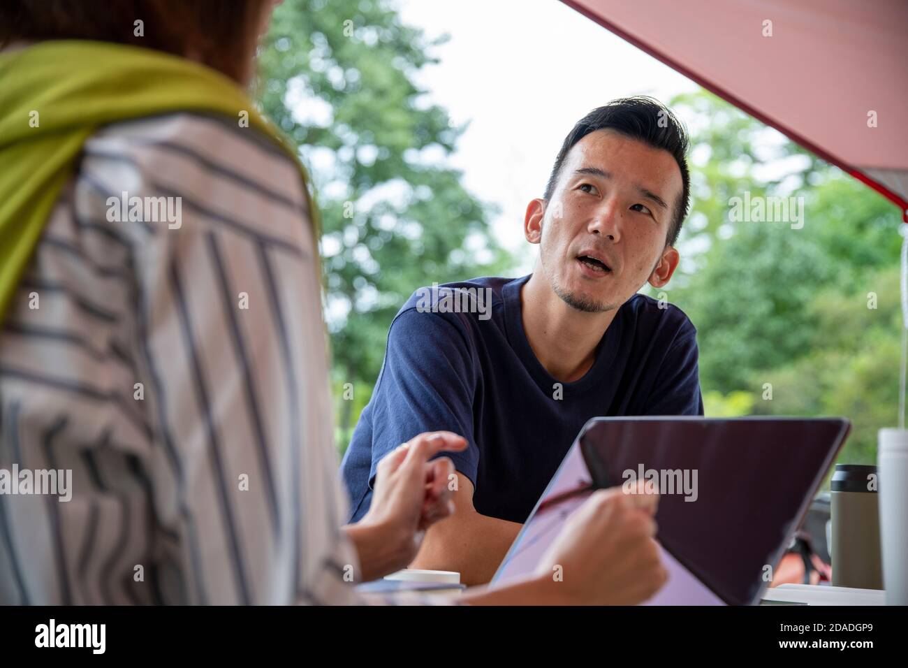 Man and Woman Having a Meeting on an Outdoor Office as New Normal Work ...