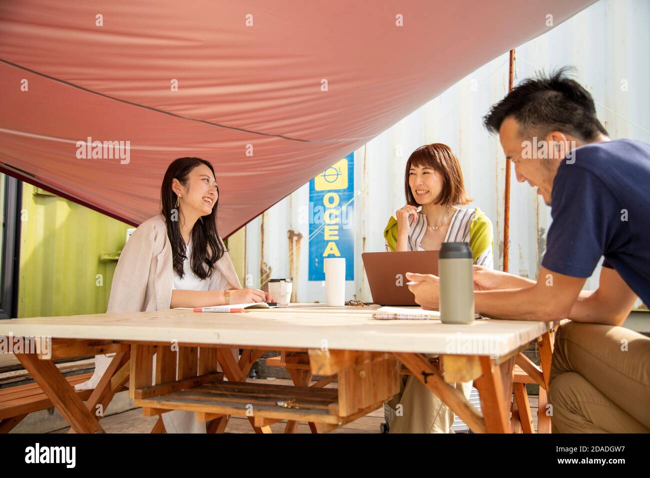 Man and Women Having a Meeting on an Outdoor Office as New Normal Work ...