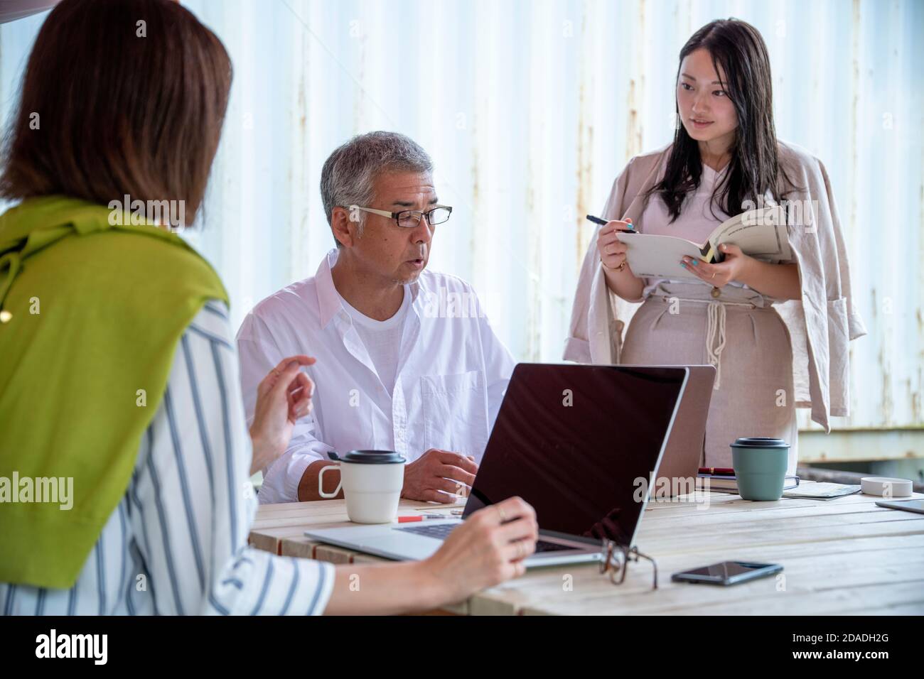 Man and Women Having a Meeting on an Outdoor Office as New Normal Work ...