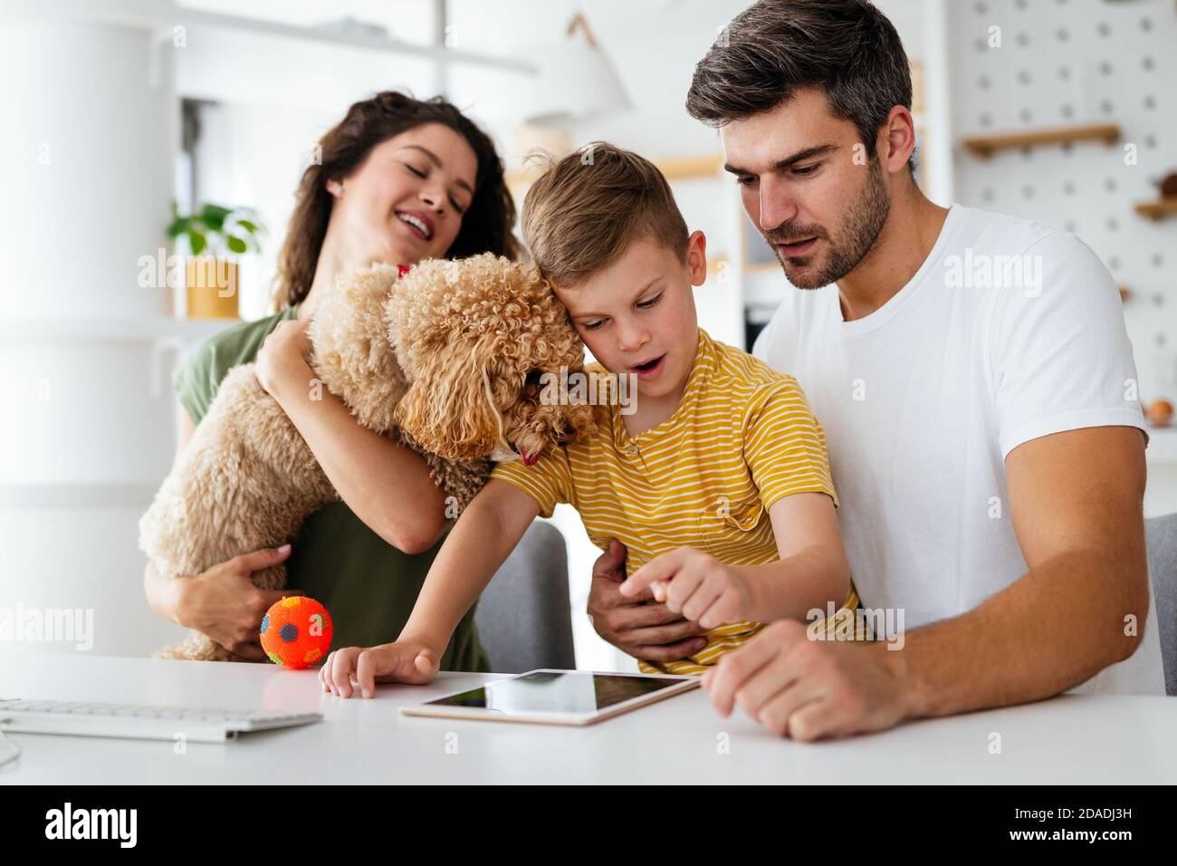 Parents helping to children studying online at home. Lockdown and ...