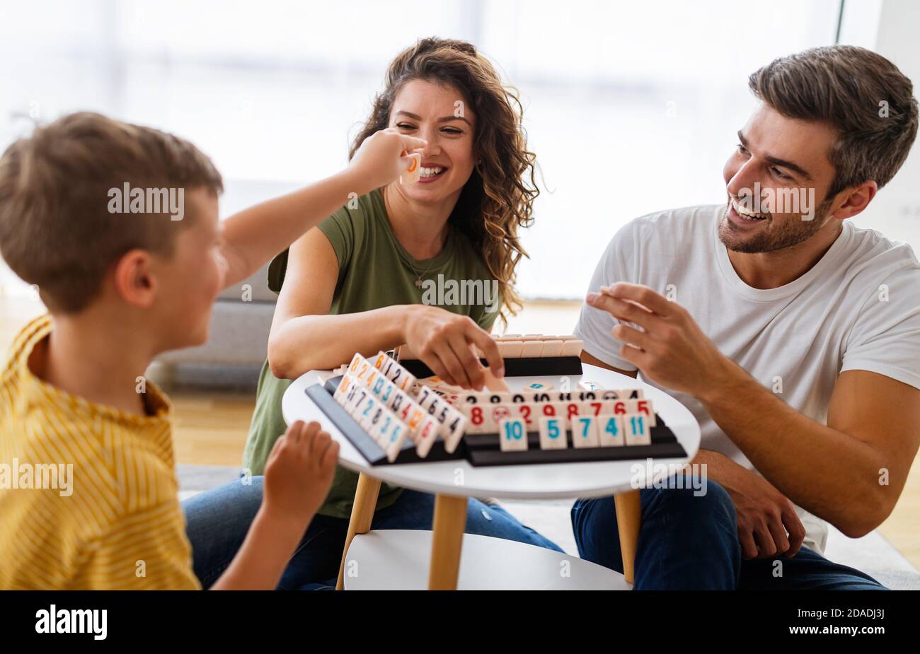Happy family having fun time at home Stock Photo - Alamy