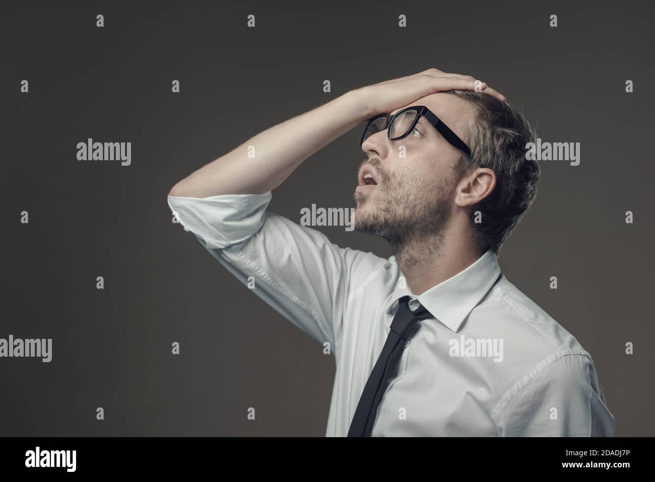 Stressed frustrated businessman making a facepalm gesture, he feels ...
