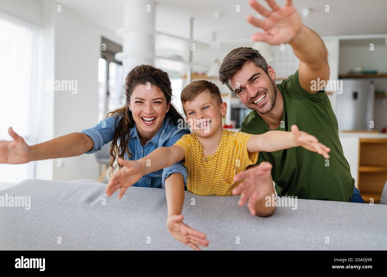 Happy family having fun time at home Stock Photo - Alamy