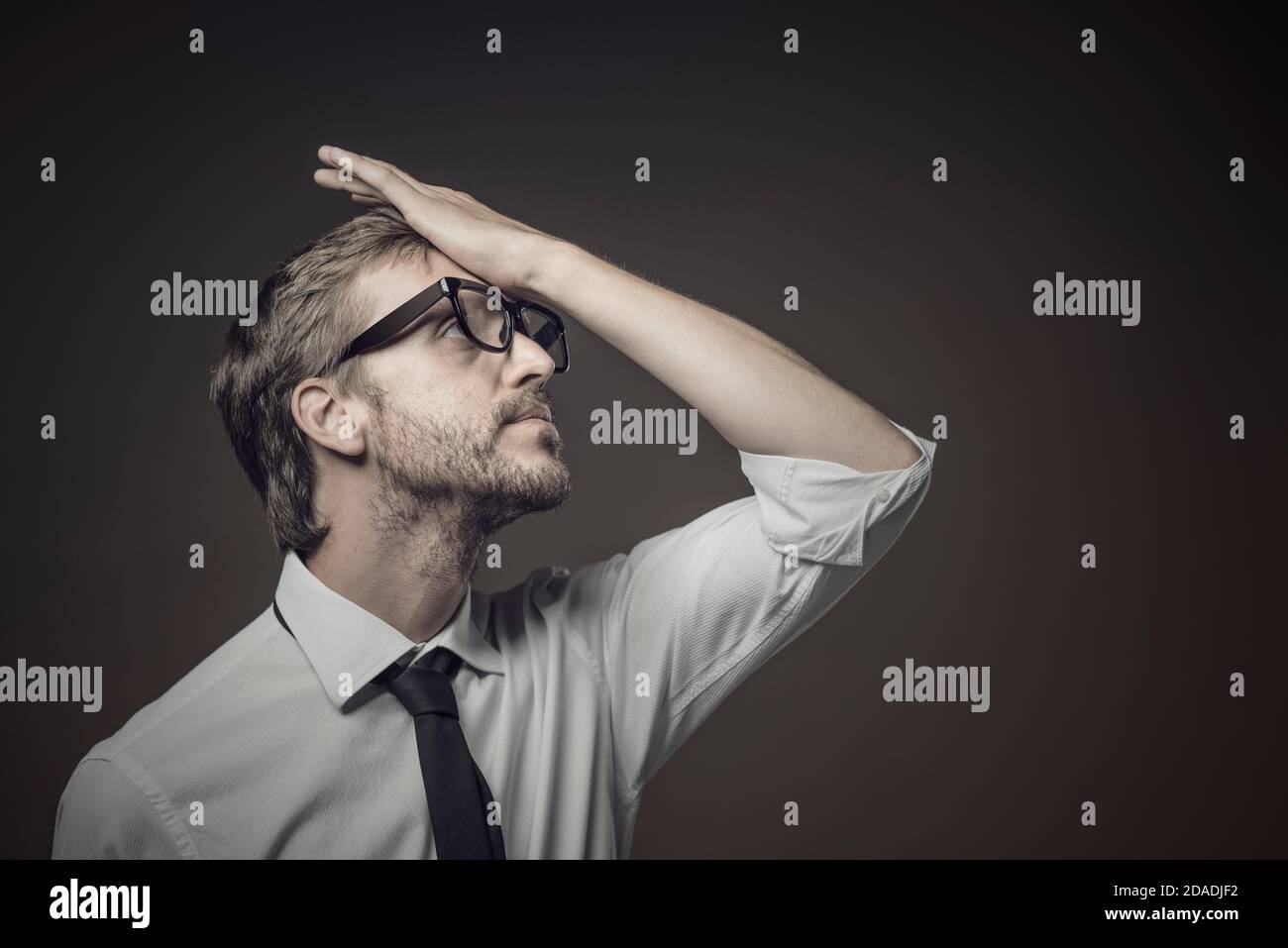 Stressed frustrated businessman making a facepalm gesture, he feels ...