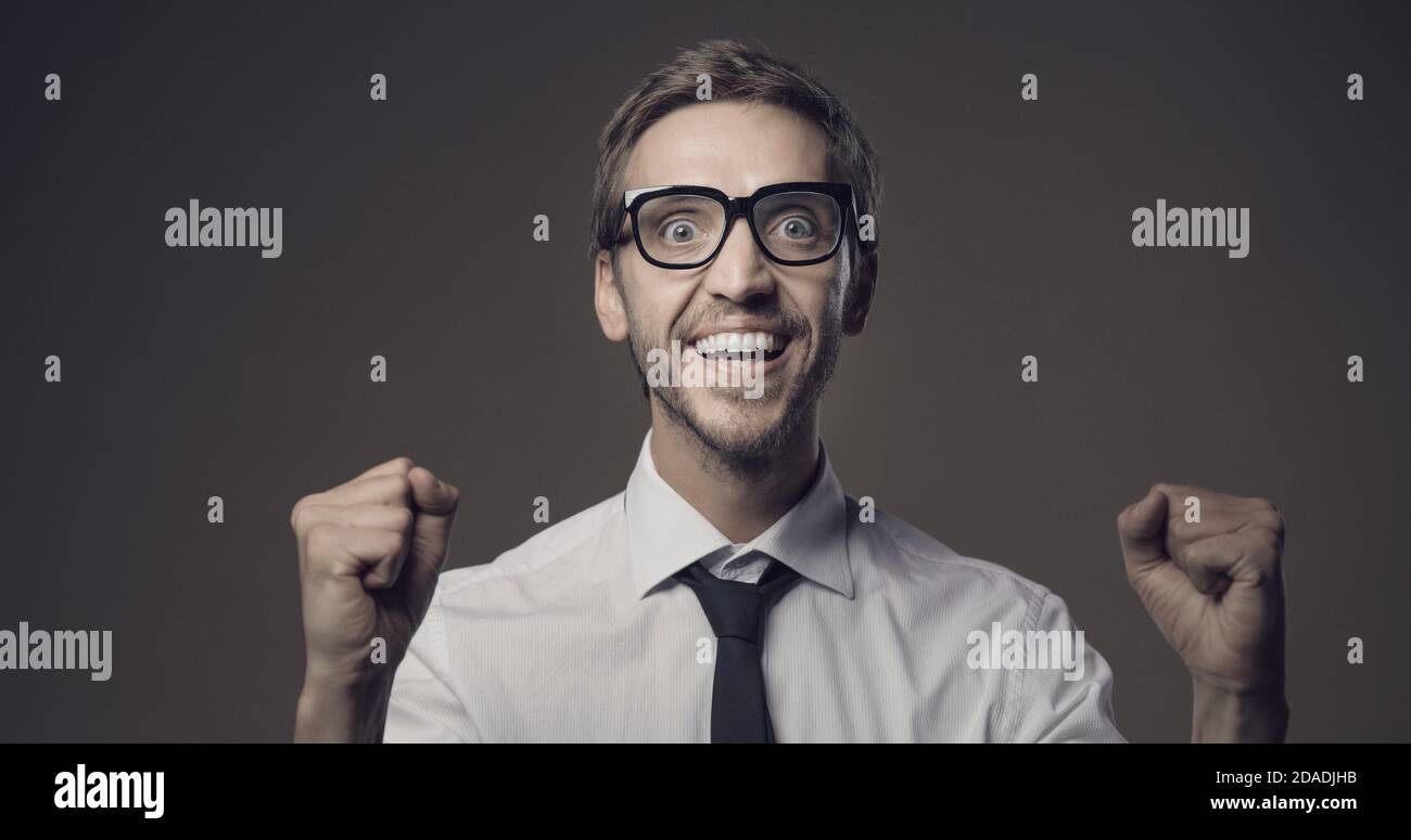 Cheerful happy man celebrating with raised fists, achievement and ...