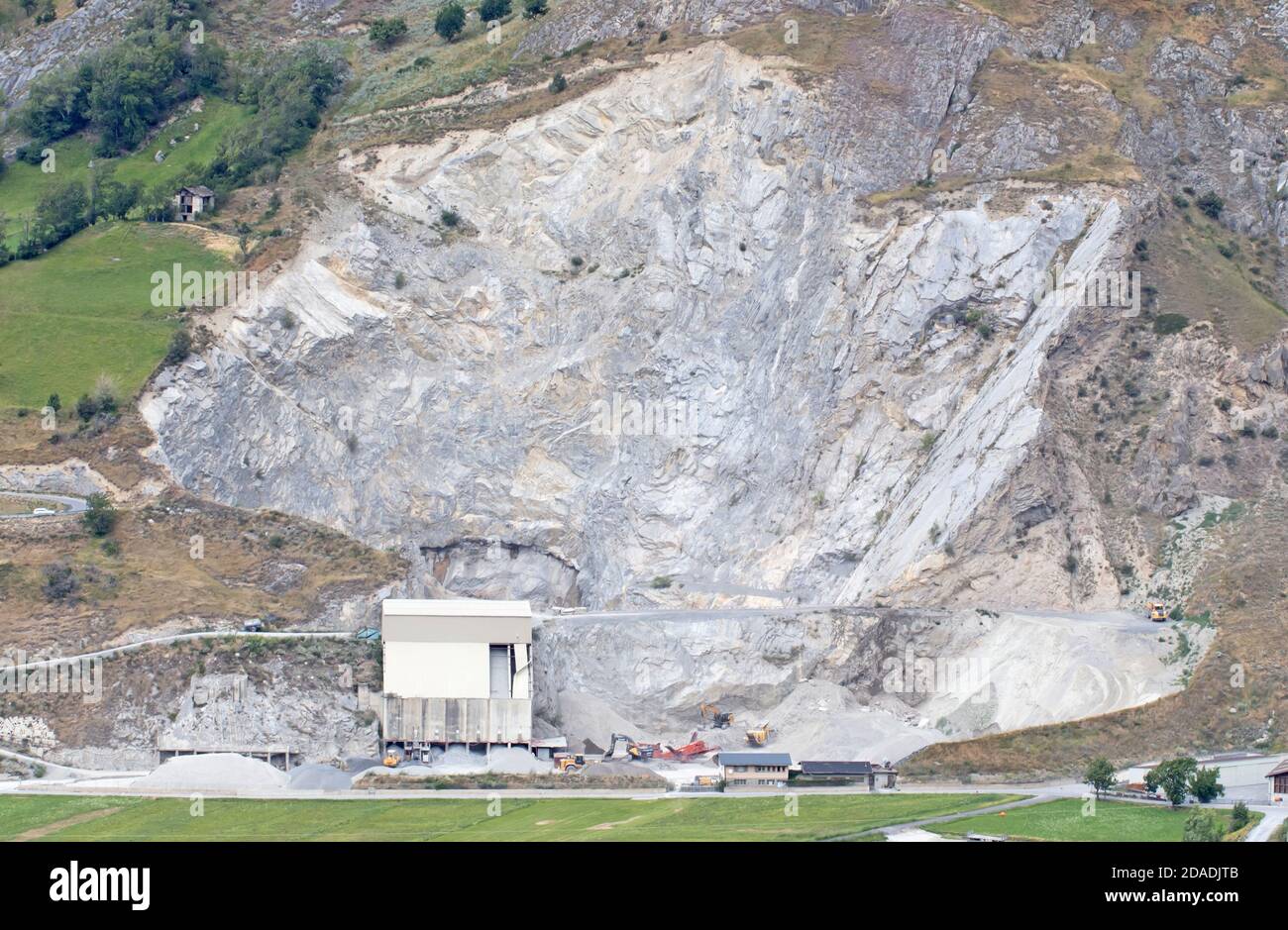Stone quarry in Switzerland, heavy machinery working with heavy ...