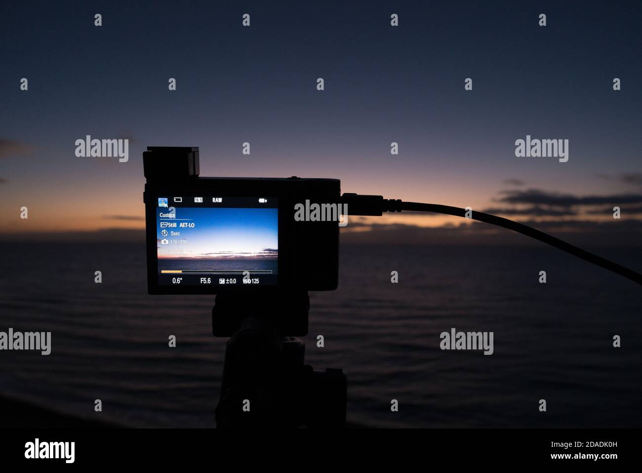Sunset photography. Camera with tripod Sunset. Sunset Stock Photo - Alamy