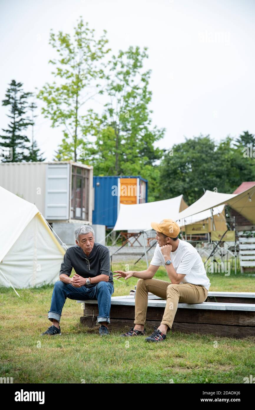Men in the Camp Site Stock Photo - Alamy