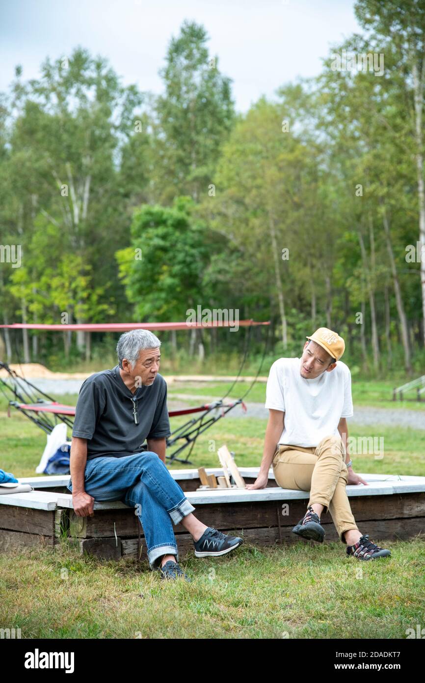 Men in the Camp Site Stock Photo - Alamy