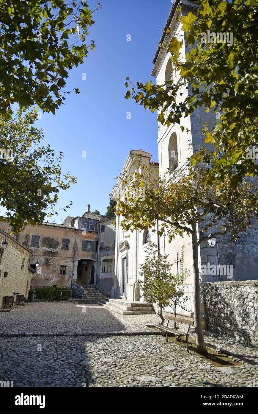 A narrow street among the old houses of Fumone, a medieval village in ...