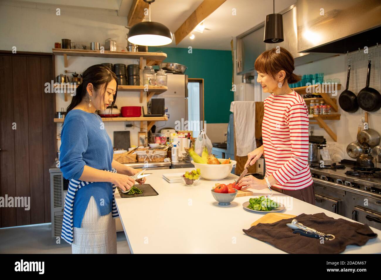 Women Cooking in the Shared Kitchen Stock Photo - Alamy