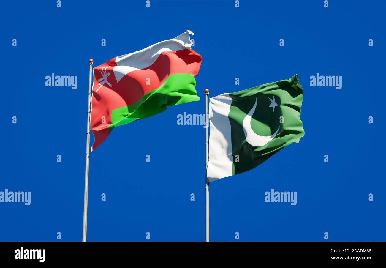 Beautiful national state flags of Oman and Pakistan together at the sky ...