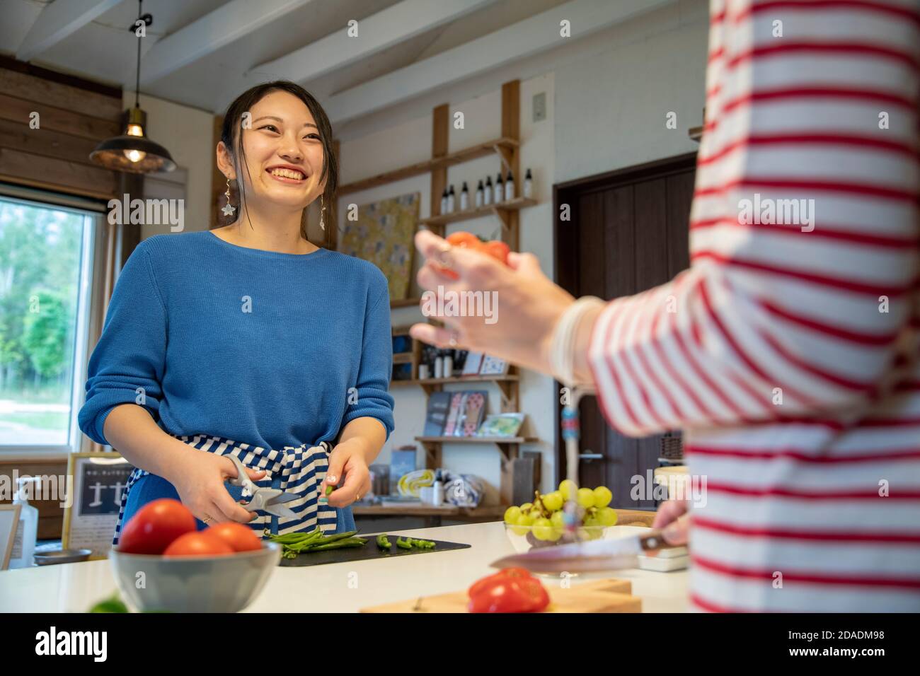 Women Cooking in the Shared Kitchen Stock Photo - Alamy