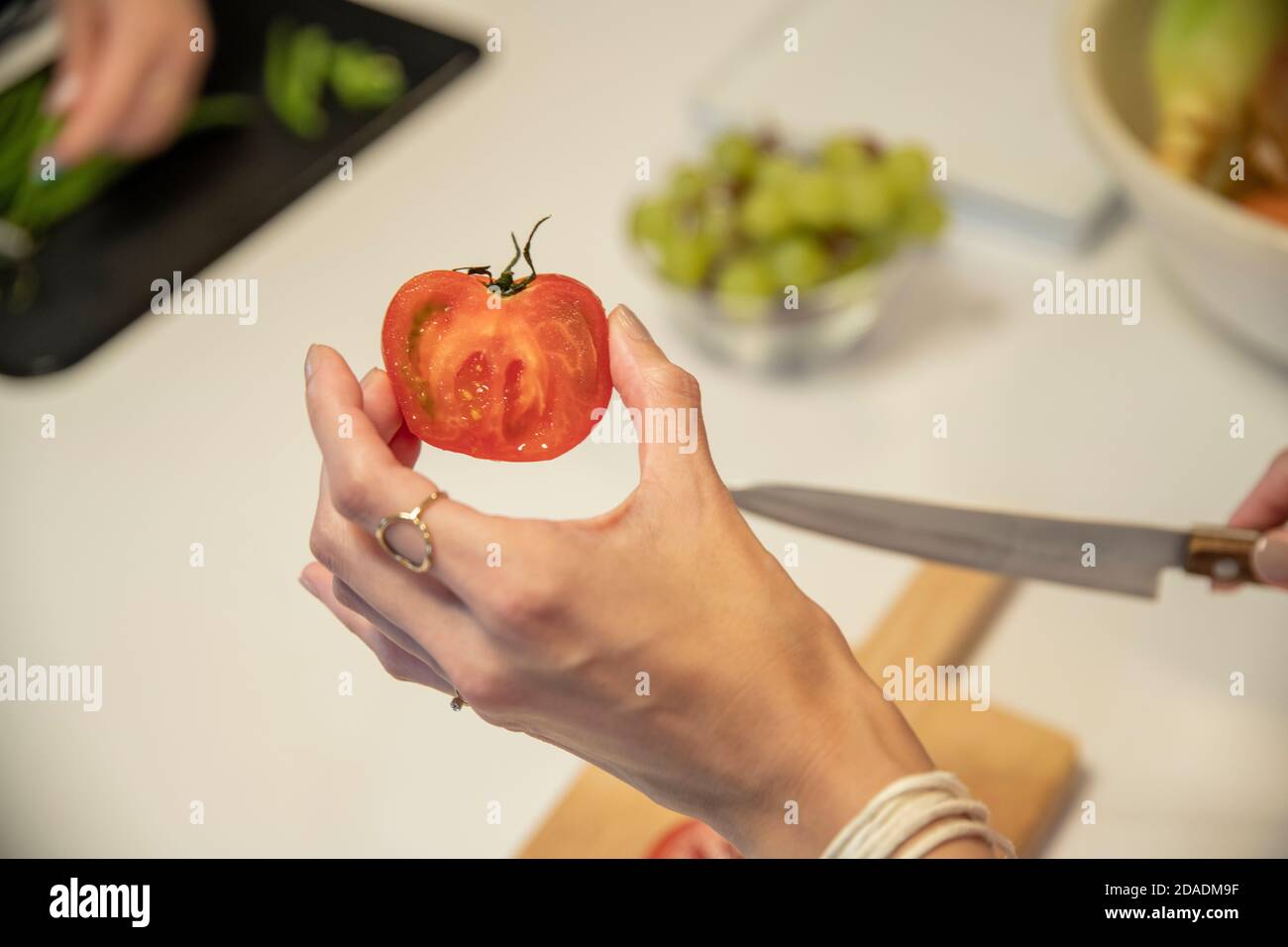 Woman Cooking in the Shared Kitchen Stock Photo - Alamy