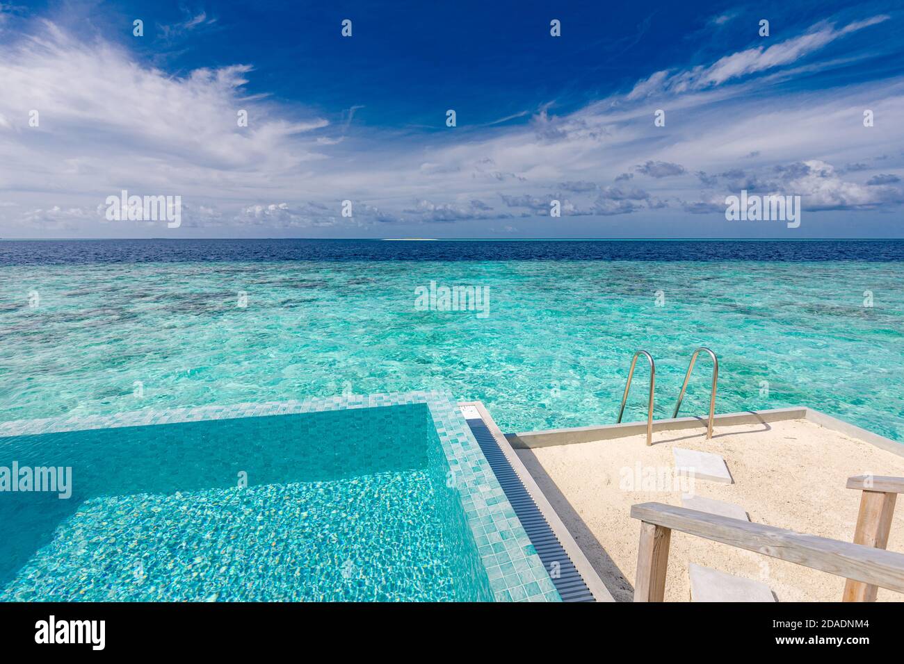 Infinity pool on the bright summer day. Infinity swimming pool in ...