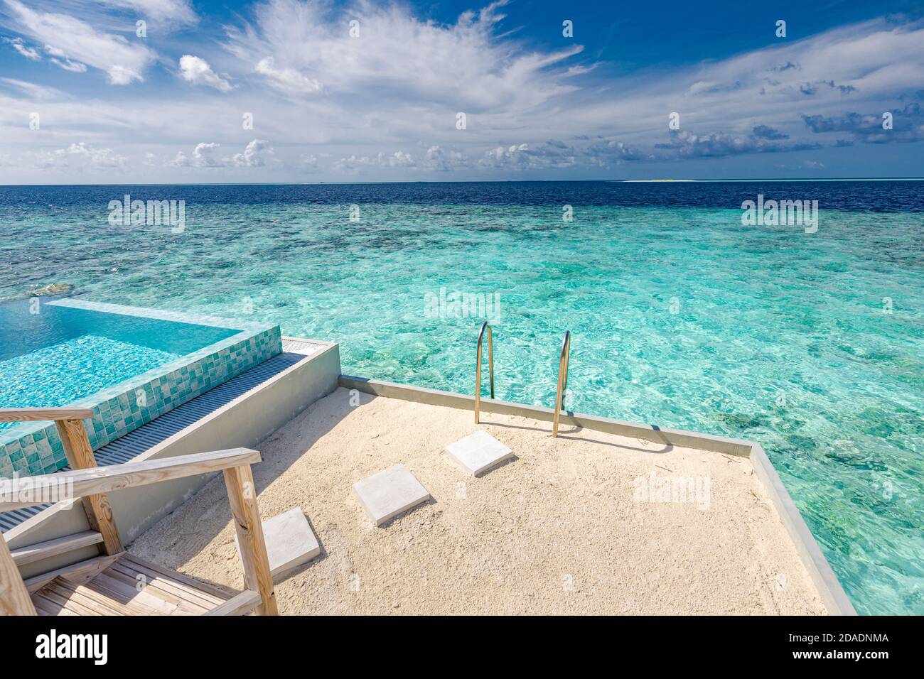 Infinity pool on the bright summer day. Infinity swimming pool in ...
