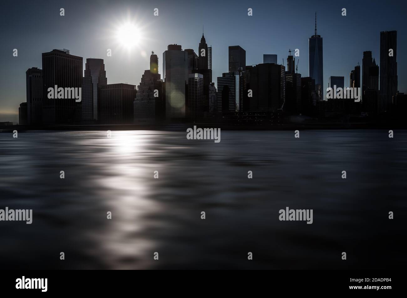 Sun over Manhattan. Evening New York City skyline panorama Stock Photo ...