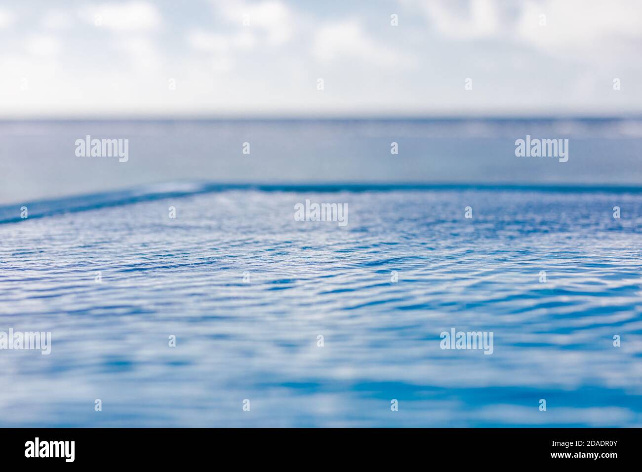 Edge of the swimming pools with turquoise azure and blue water color ...