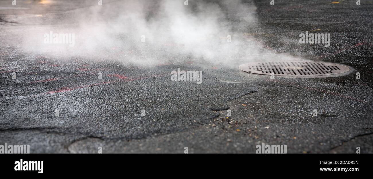 Vapor from street underground on Manhattan Stock Photo - Alamy