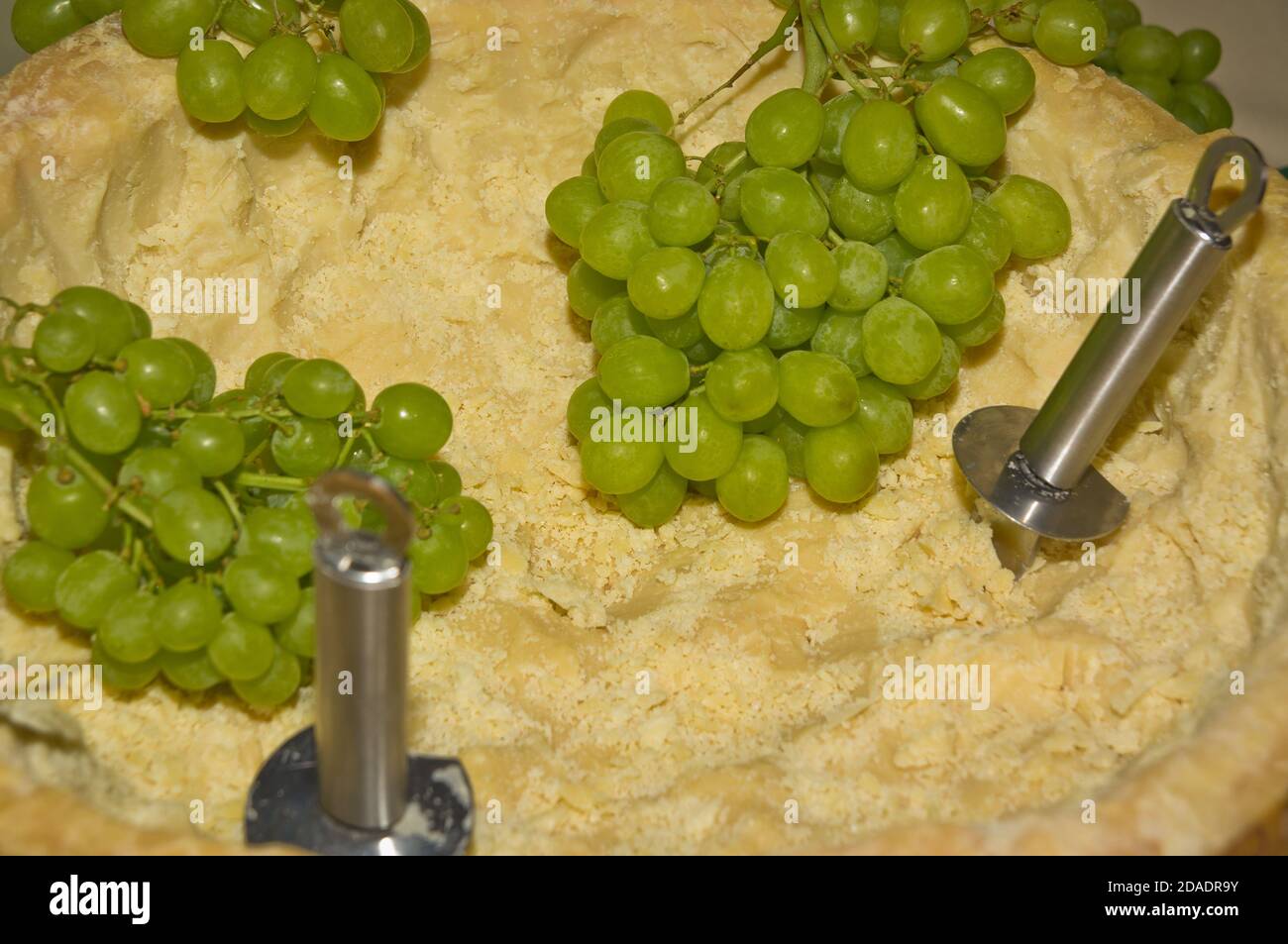 Parmesan Cheese with green grapes on a buffet Stock Photo - Alamy