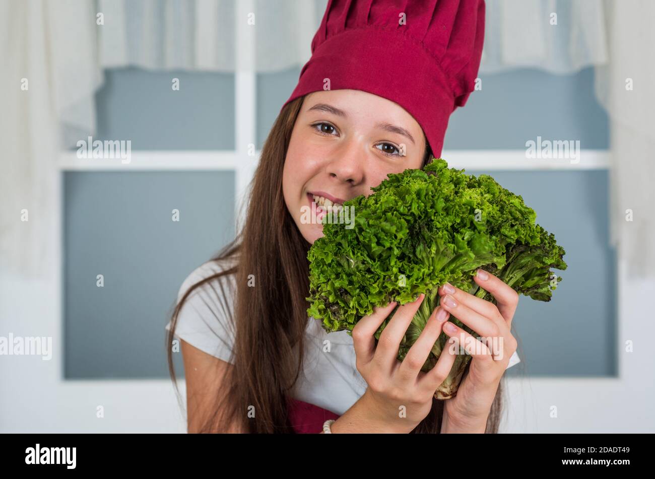 full of vitamin. kid chef cooking with salad. child prepare healthy ...