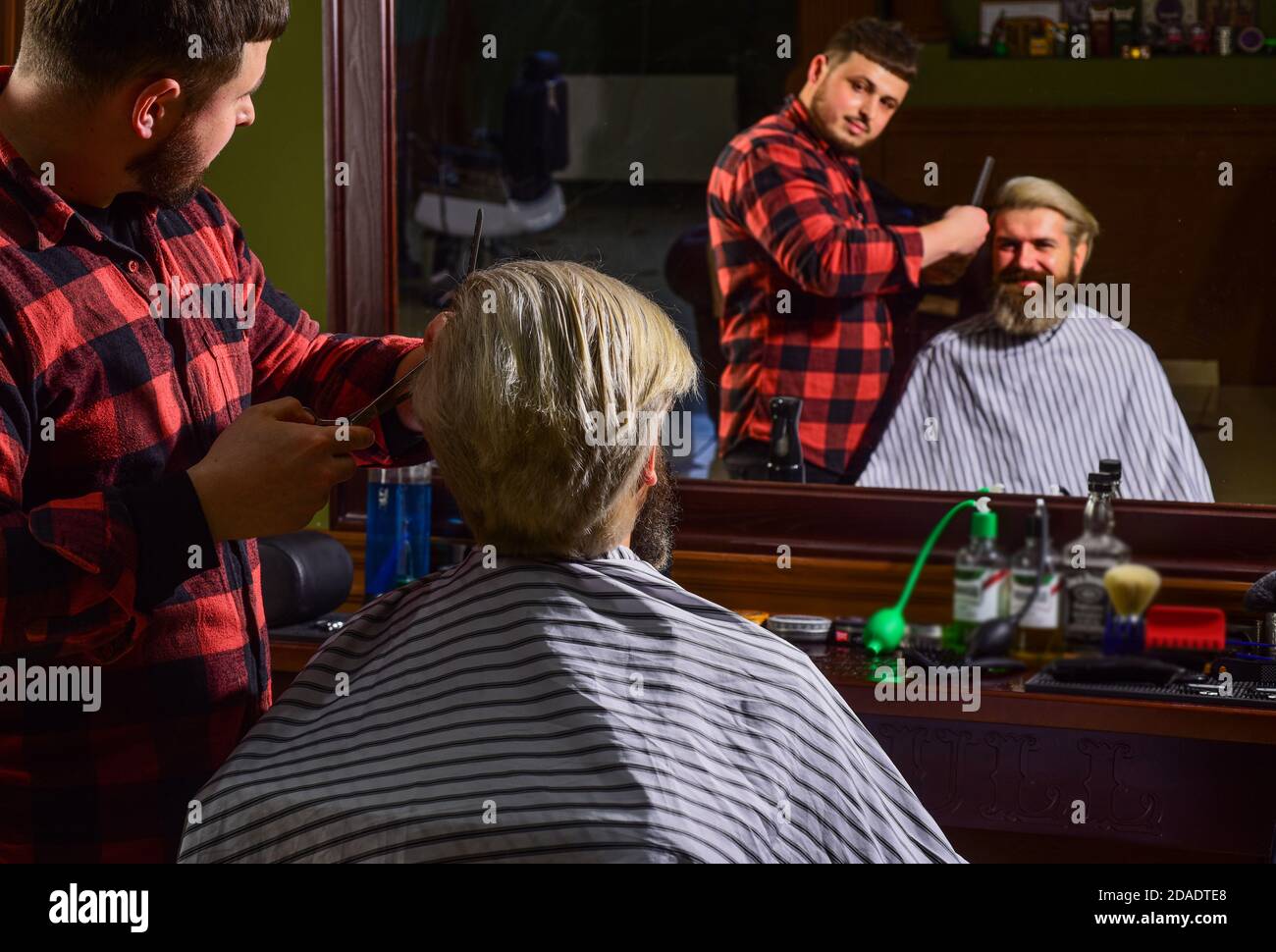Young expertise. Designing haircut. barber tools in barbershop ...