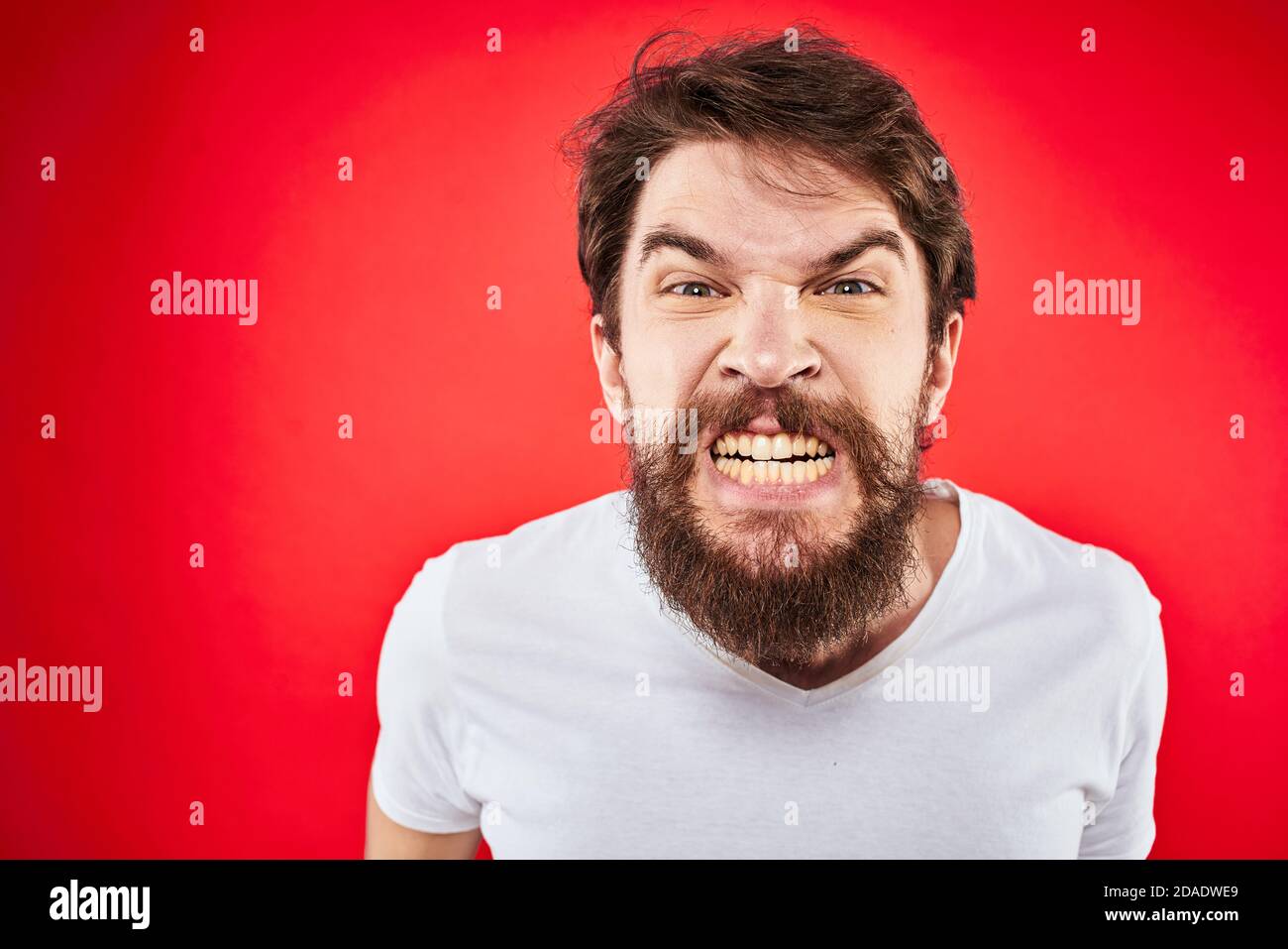 bearded man gesturing with hands white t-shirt emotions facial ...