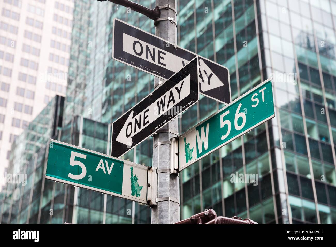 NEW YORK, USA - May 01, 2016: Street signs for Fifth avenue and W 56 st ...