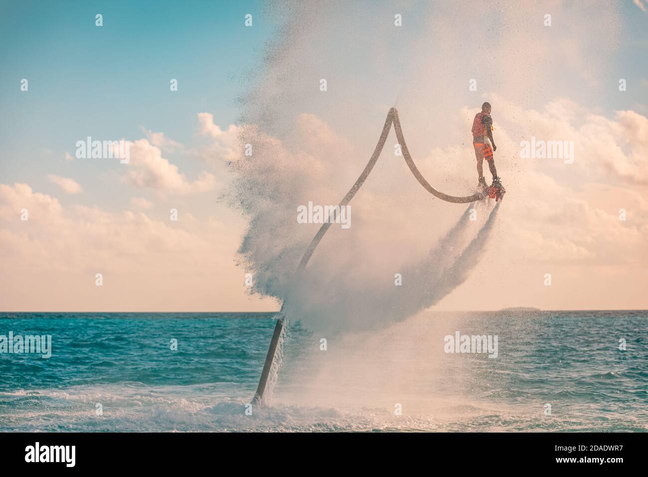 Professional pro fly board rider in tropical sea, water sports concept ...