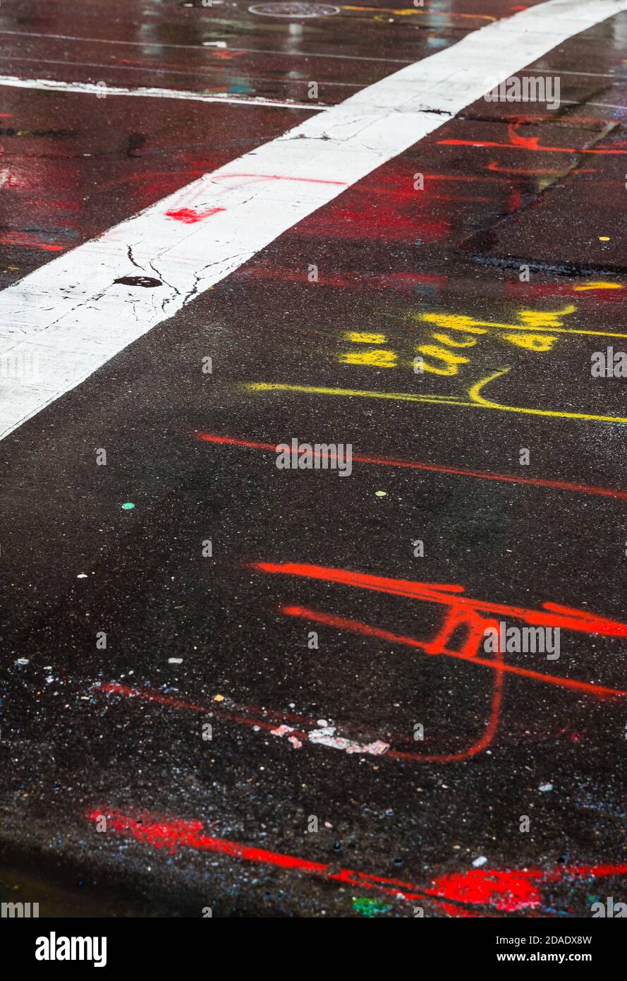 Wet asphalt with road markings and paint spots in Manhattan, New York ...