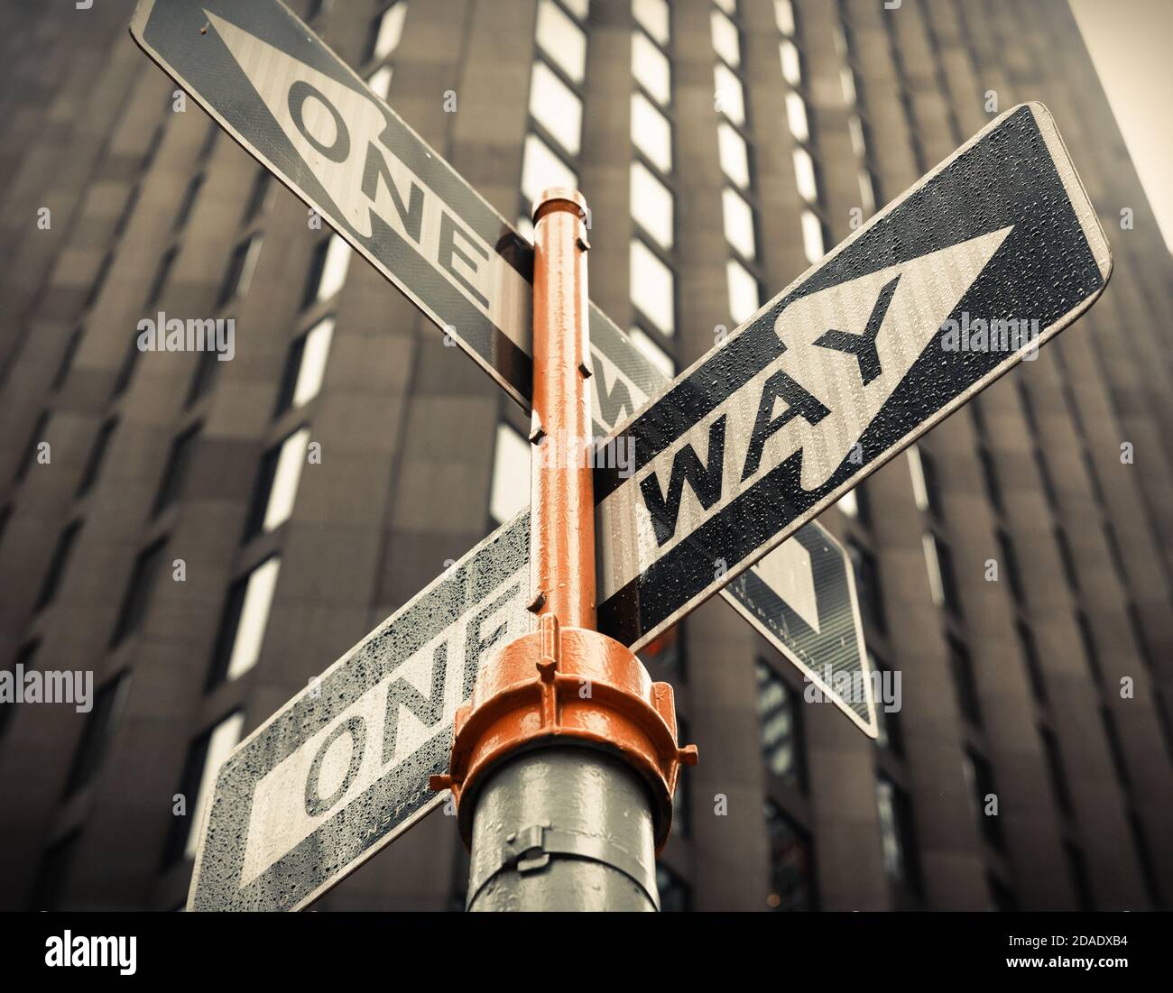 One Way road sign covered in retro style with raindrops. Streets of ...