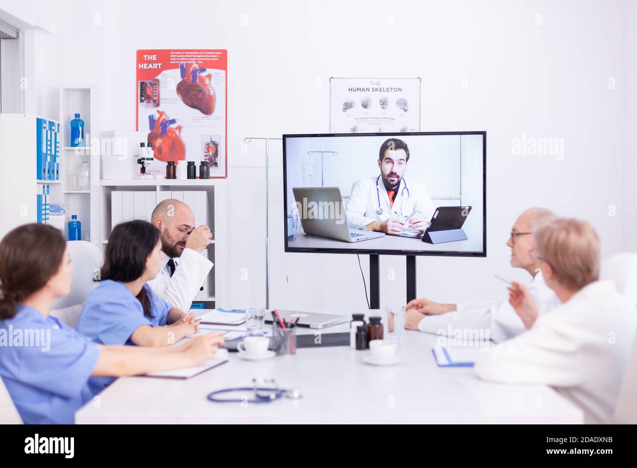 Medical staff talking with expert doctor during webinar in hospital ...