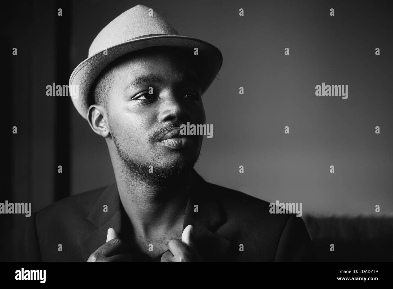 Vintage african business man mafia model in black suit. B&W style style ...