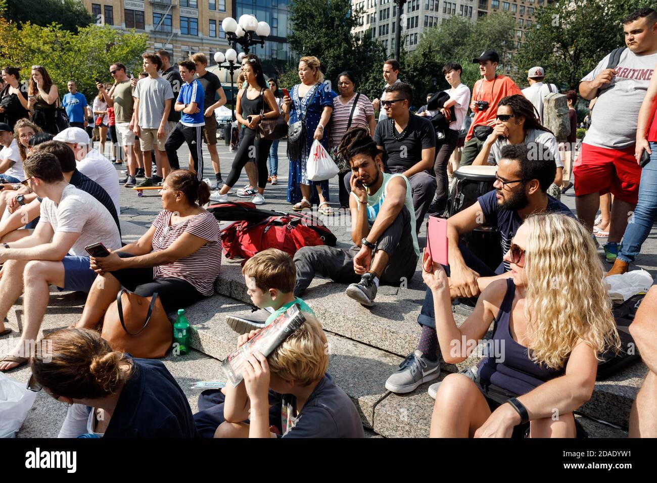 NEW YORK, USA - Sep 16, 2017: A group of young people watching the ...