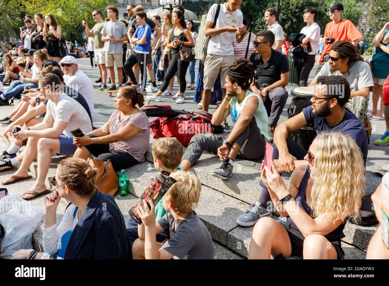 NEW YORK, USA - Sep 16, 2017: A group of young people watching the ...