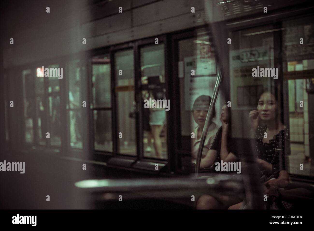 portraits of two women in the metro late at night Stock Photo - Alamy