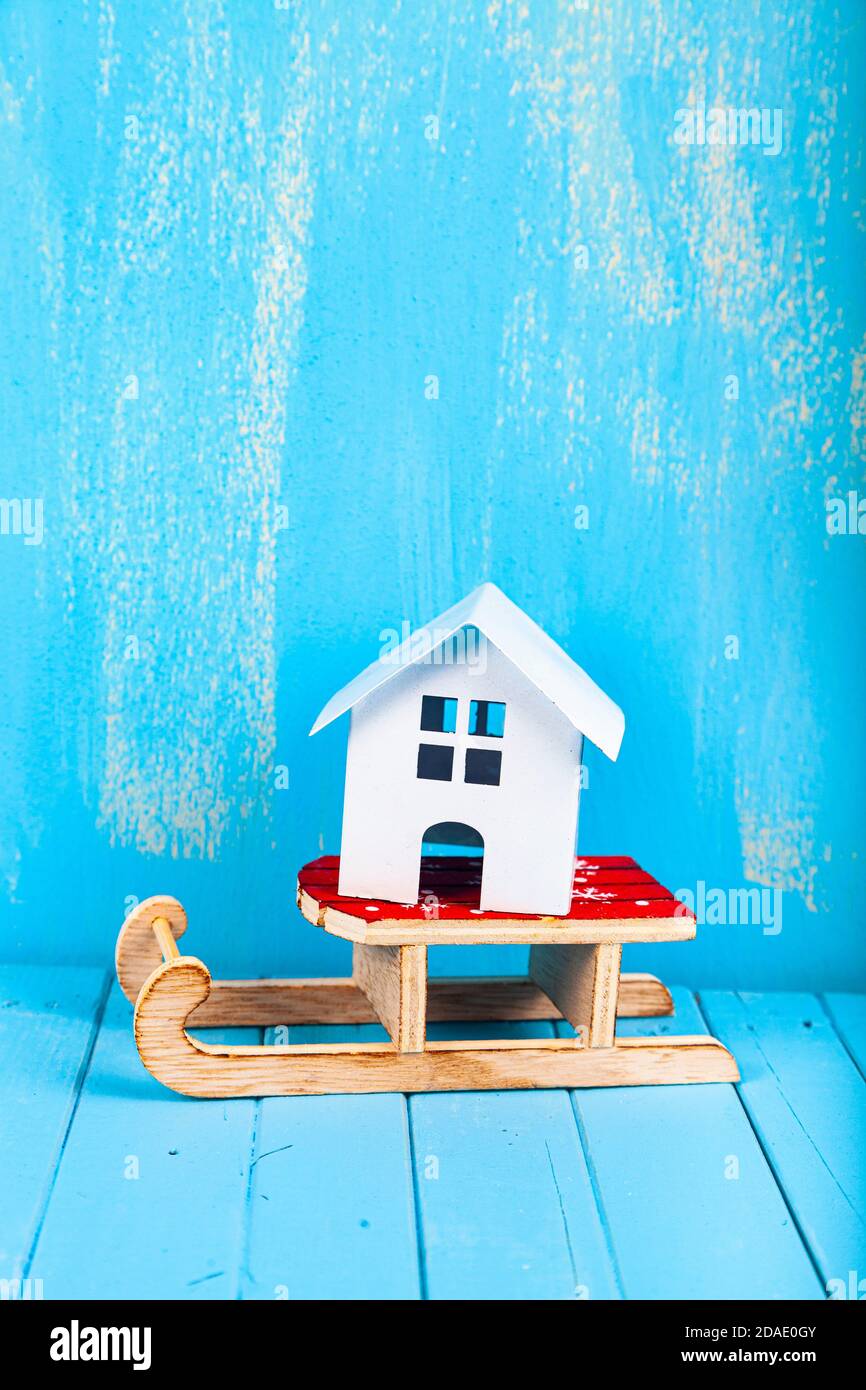 House is on a sled. Buying a property. Concept Stock Photo - Alamy