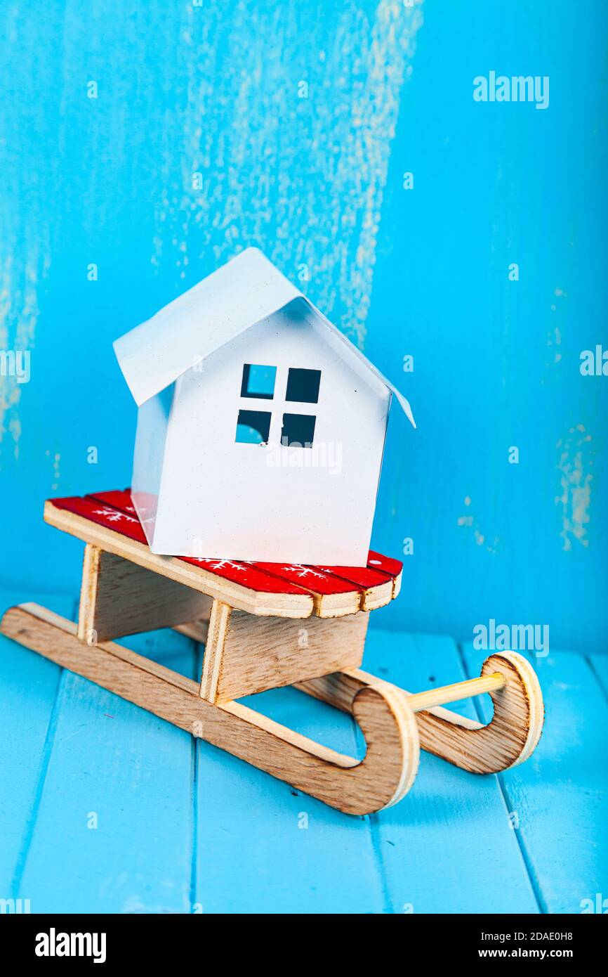 House is on a sled. Buying a property. Concept Stock Photo - Alamy