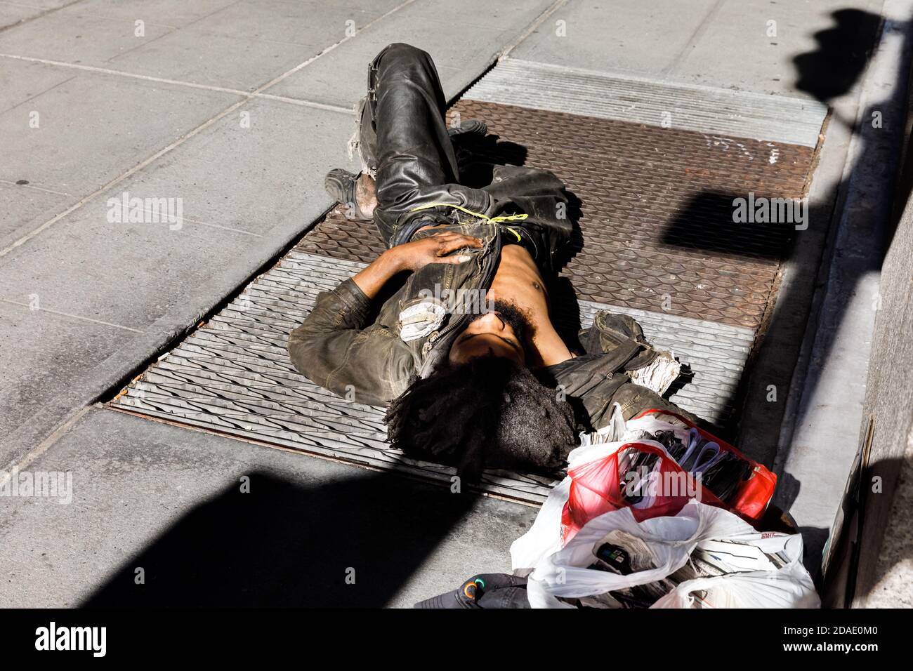 NEW YORK, USA - Sep 23, 2017: Manhattan street scene. A homeless man ...