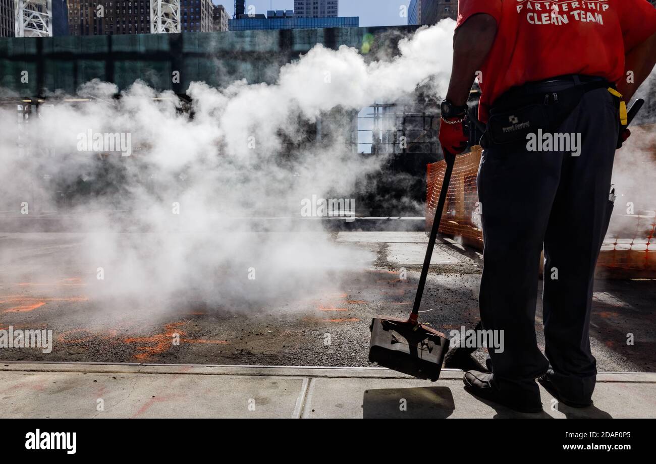 NEW YORK, USA - Sep 23, 2017: Manhattan street scene. Cleaner sweeps ...