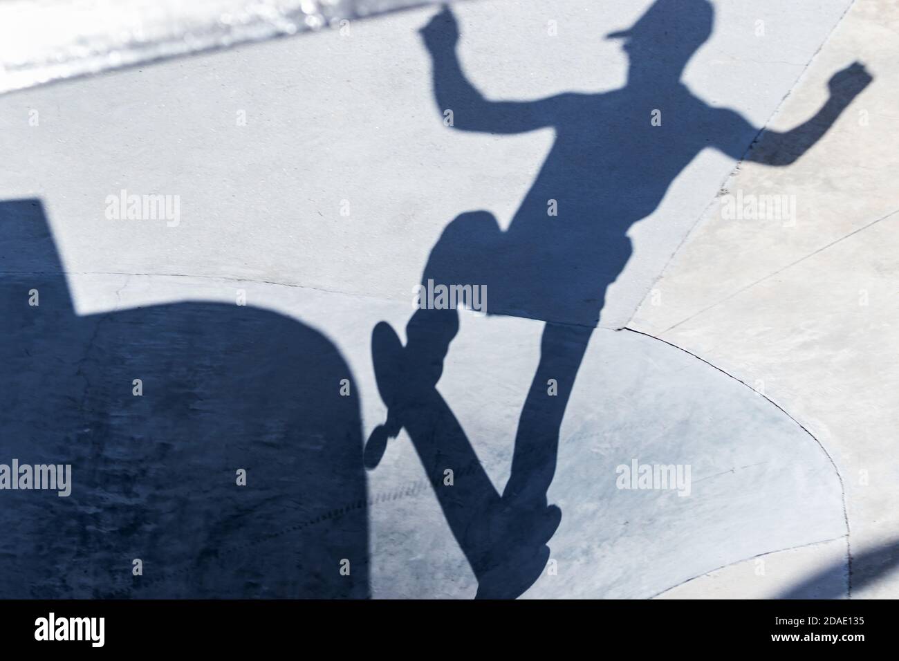 Shadow of a skateboarder stretched on the ground Stock Photo - Alamy
