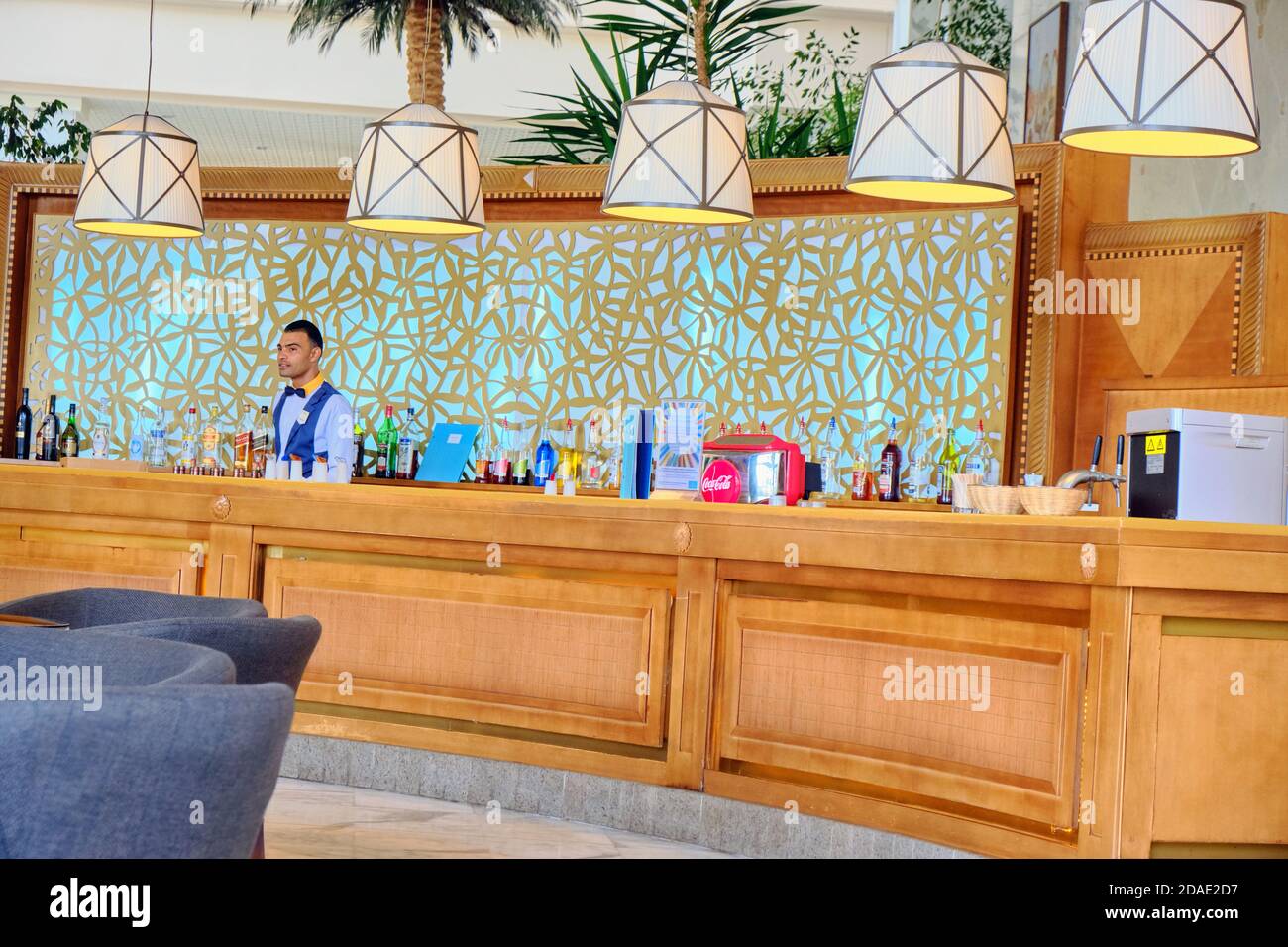 The bartender at the bar in the Arab cafe. Arabic restaurant in a hotel ...