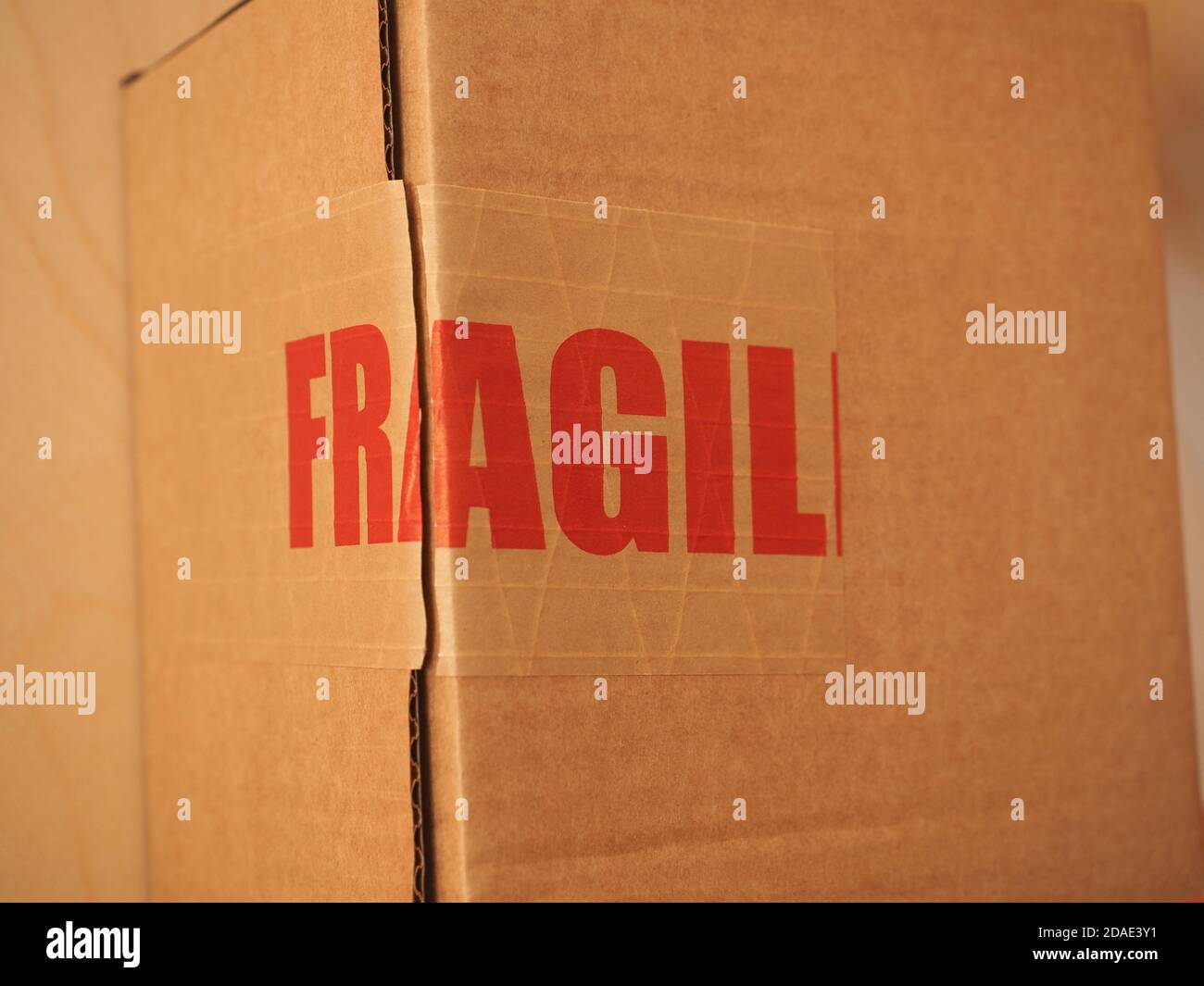 Fragile brown corrugated cardboard box packet parcel Stock Photo - Alamy