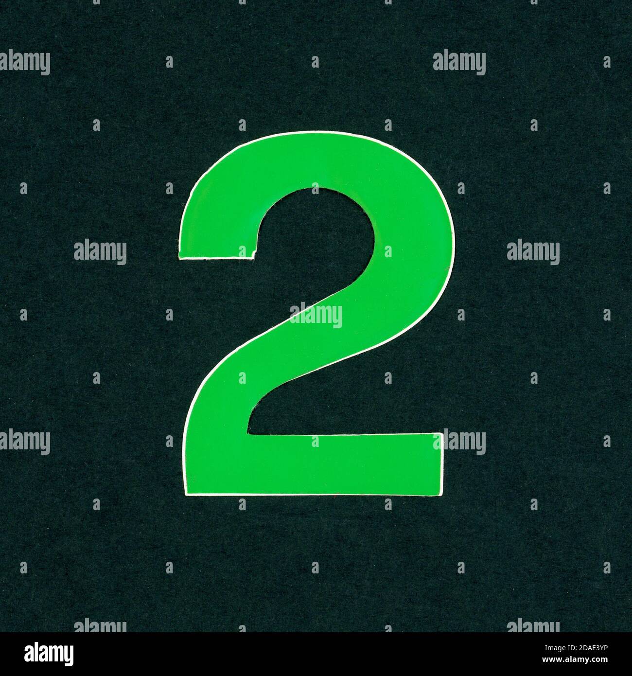 Green number two digit over black background Stock Photo - Alamy
