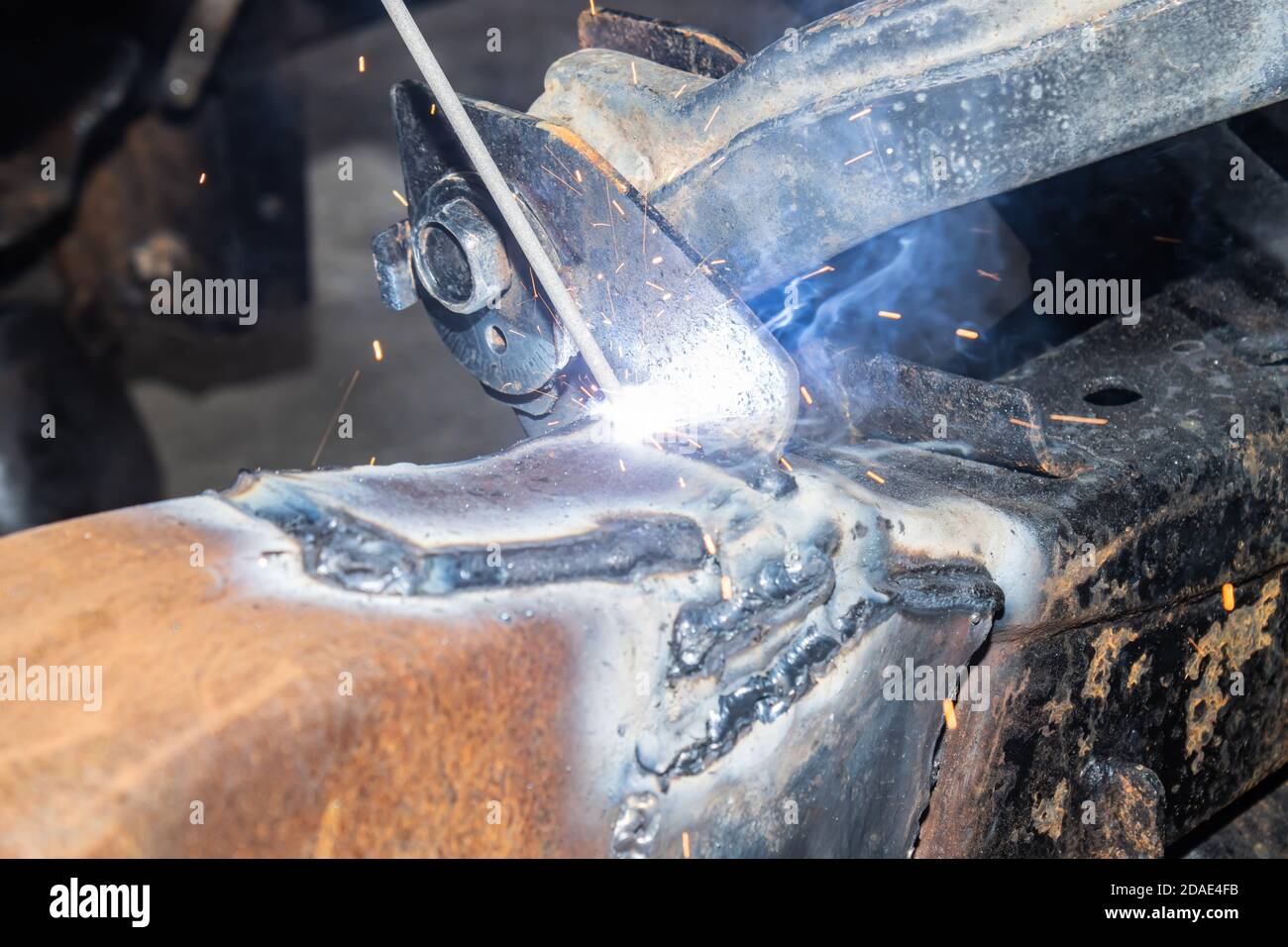 Electrode Arc Welding by Welder at Bottom Car Chassis Area in Zoom View ...