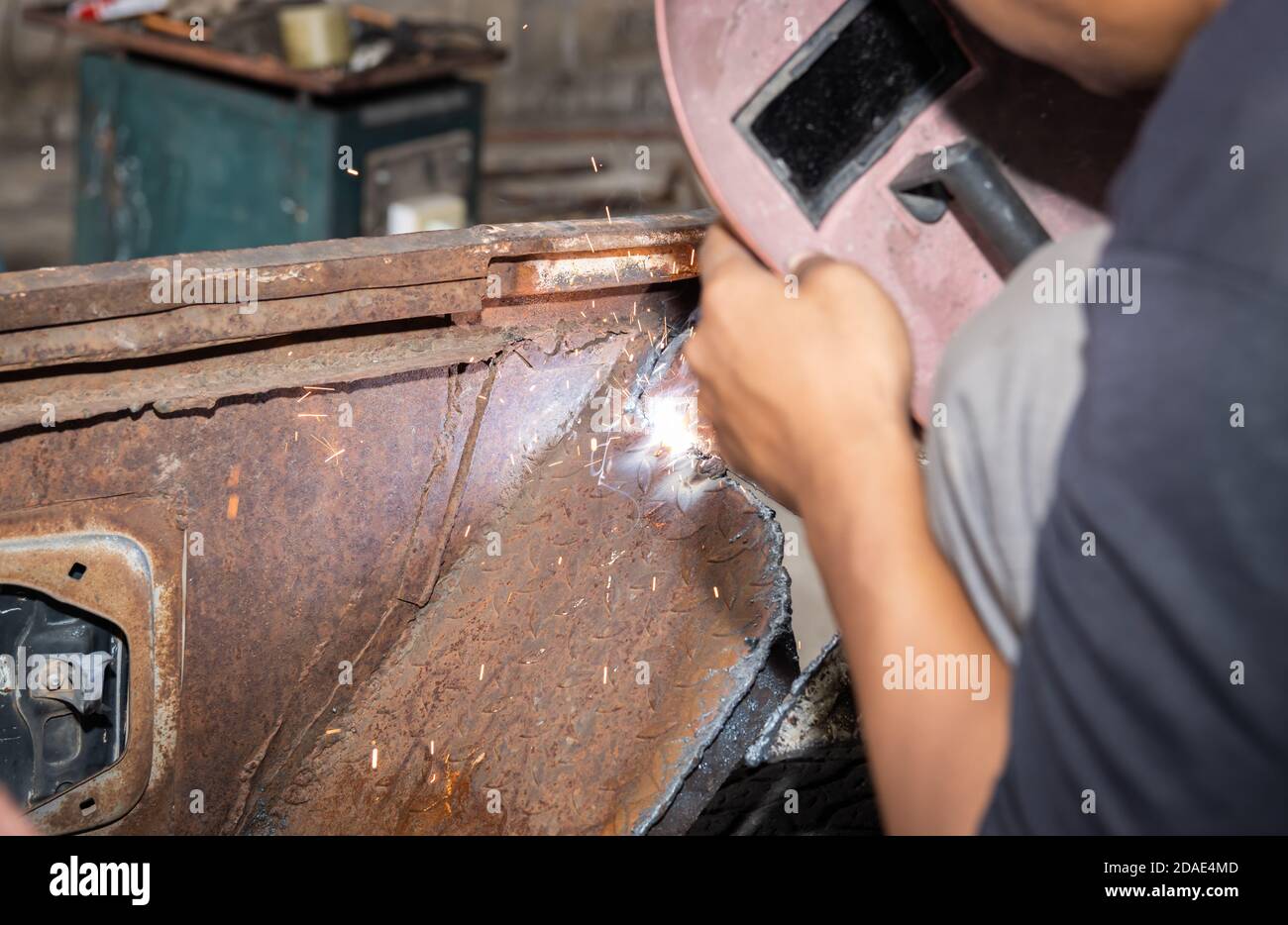 Welding Man Welding Car Mudguard or Construction in Garage by Electrode ...