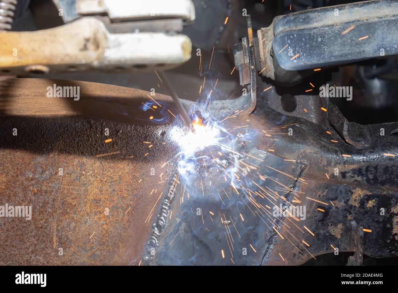 Welder Welding Bottom Car Chassis by Electric Welding Torch on Center ...