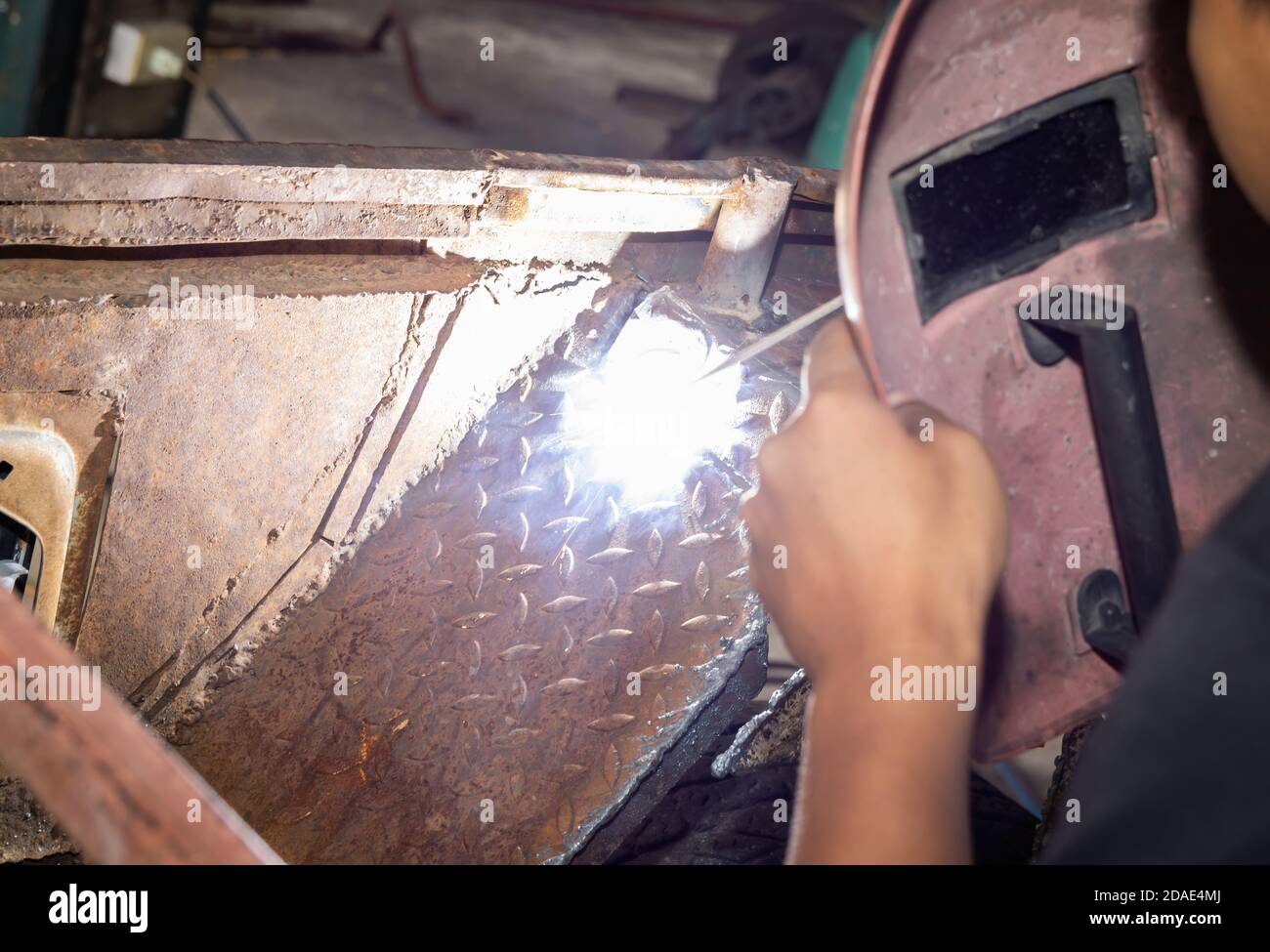Welding Man Welding Car Mudguard or Construction in Garage by Electrode ...